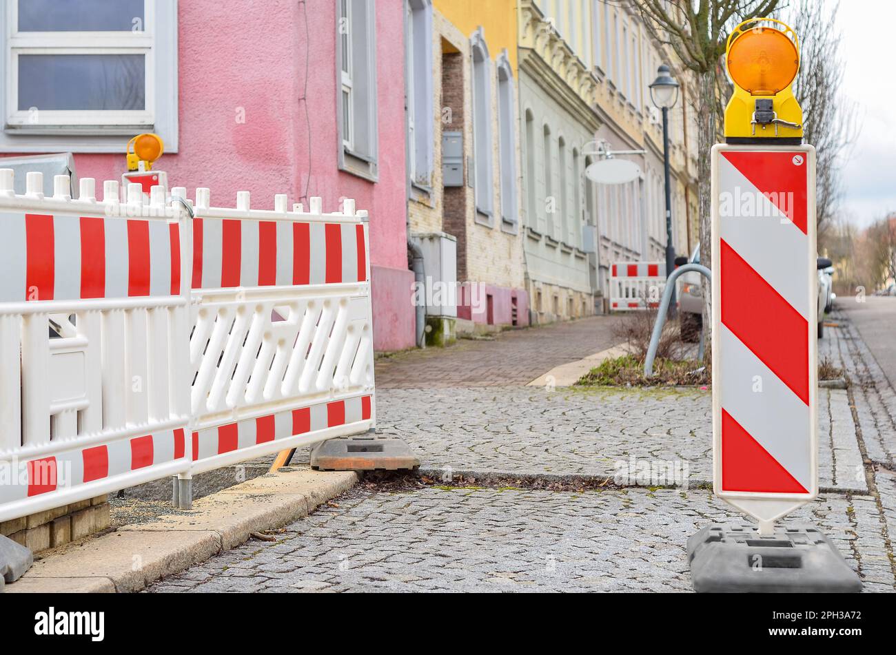 View of road divider on city street Stock Photo - Alamy