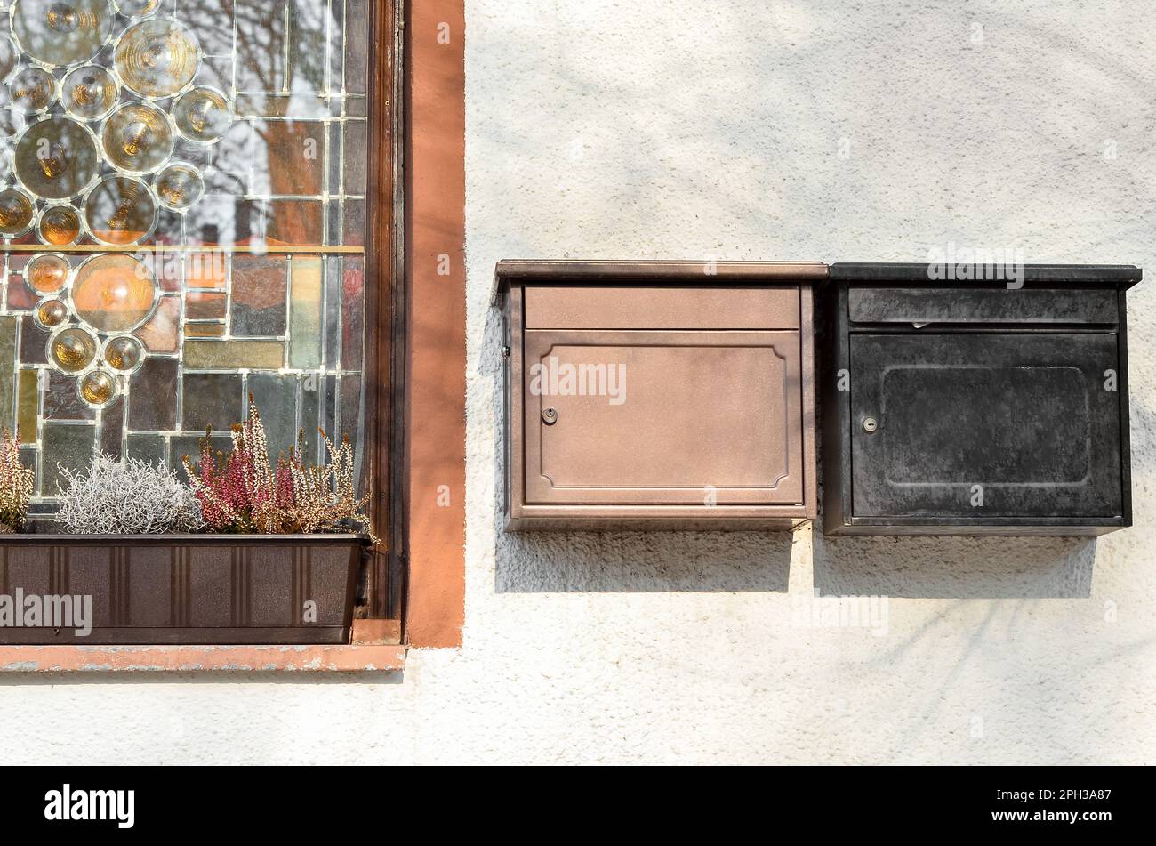View of mailboxes on white building wall Stock Photo - Alamy