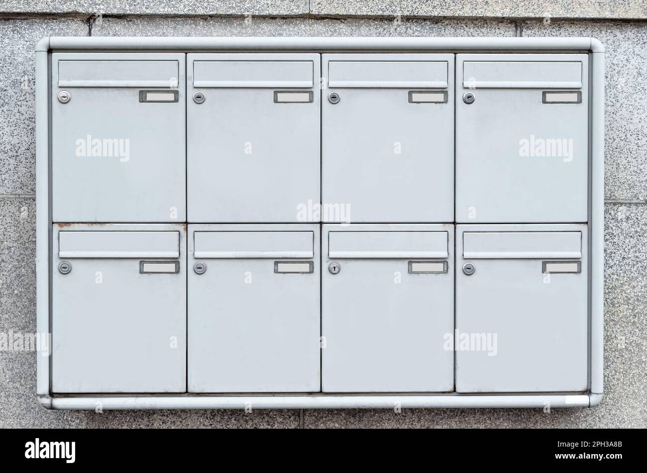 View of white mailboxes on building wall Stock Photo - Alamy