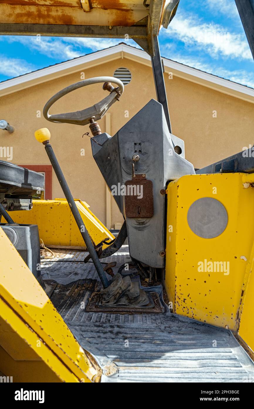 The cab of a backhoe parked with the keys in the ignition Stock Photo ...