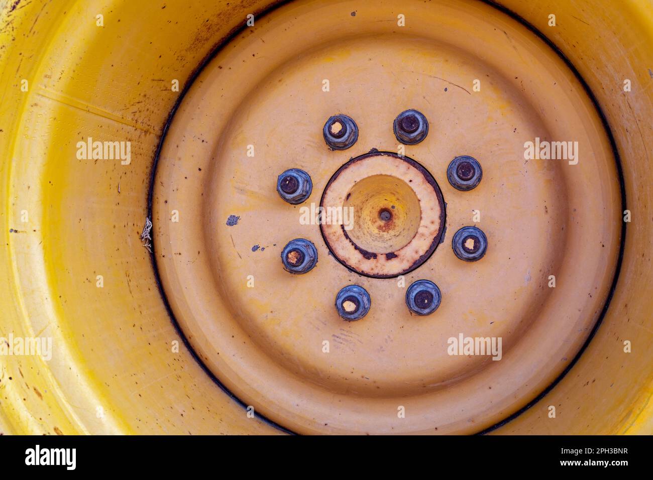 Detail of bolts on the rim of a backhoe wheel Stock Photo - Alamy