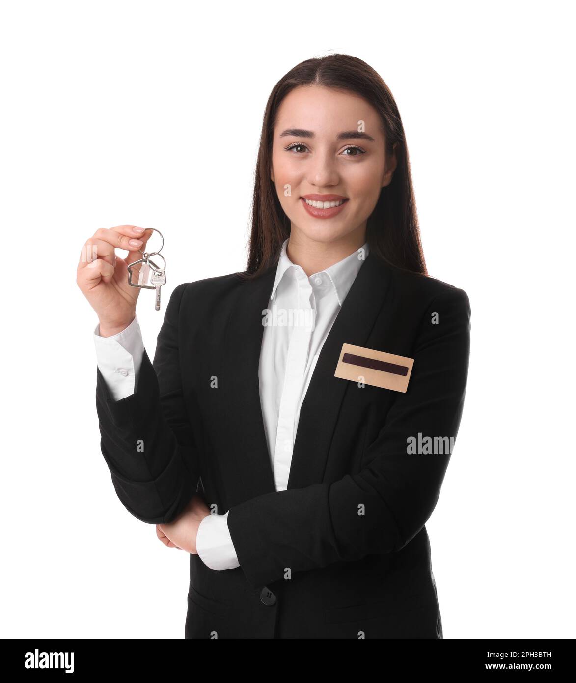 Happy young receptionist in uniform holding key on white background ...