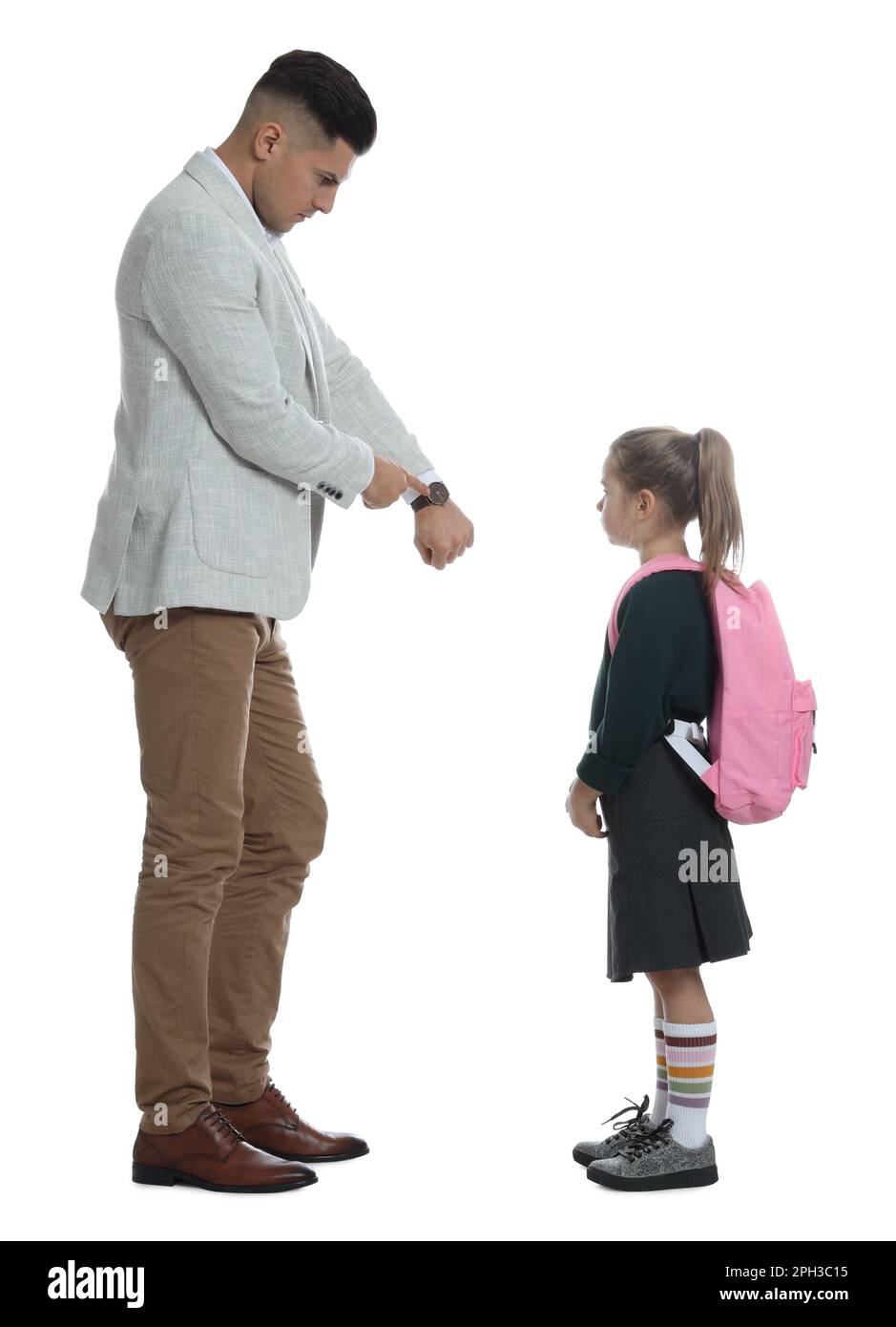 Teacher pointing on wrist watch while scolding pupil for being late ...