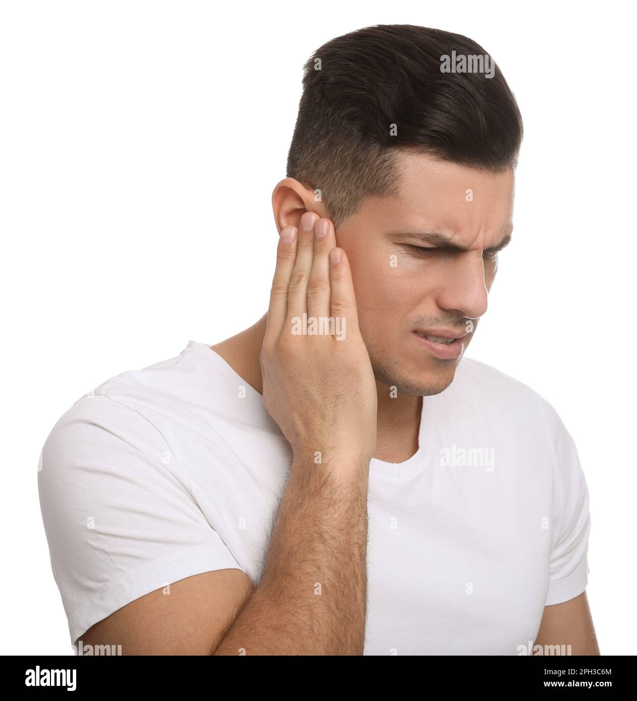 Man suffering from ear pain on white background Stock Photo - Alamy