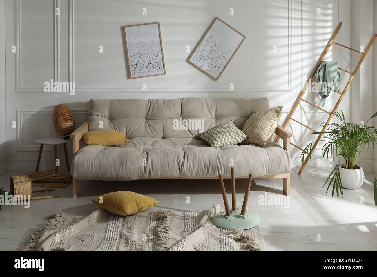 View on messy living room interior after earthquake Stock Photo - Alamy