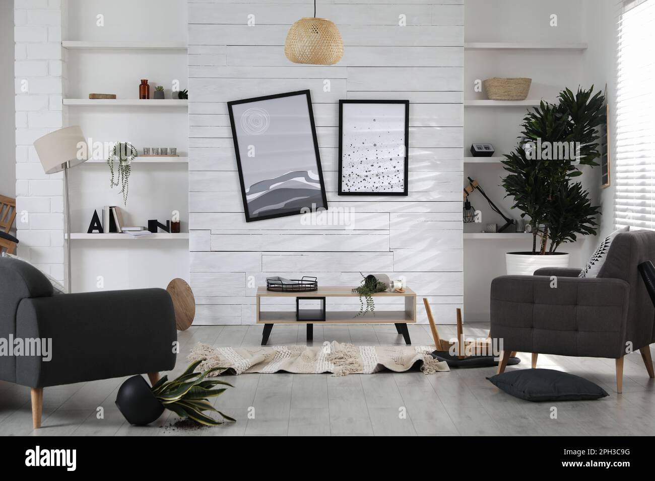 Chaotic living room interior after strong earthquake Stock Photo - Alamy