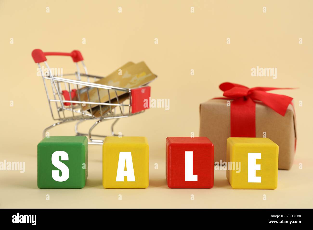 Word Sale made with colorful cubes, gift box and credit cards in ...