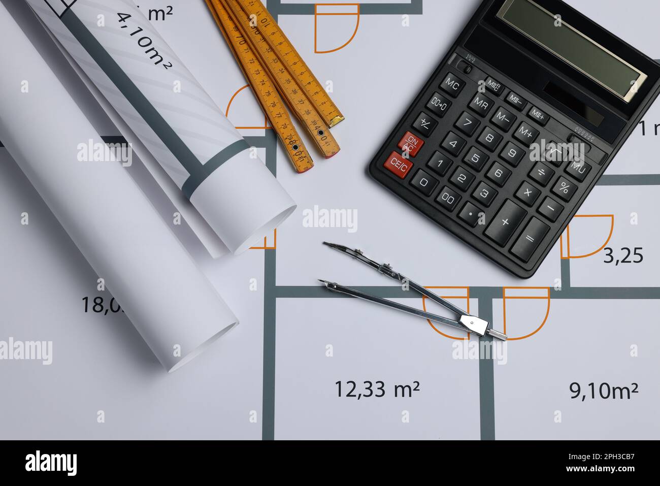 Construction drawings, pair of compasses, calculator and folding ruler ...