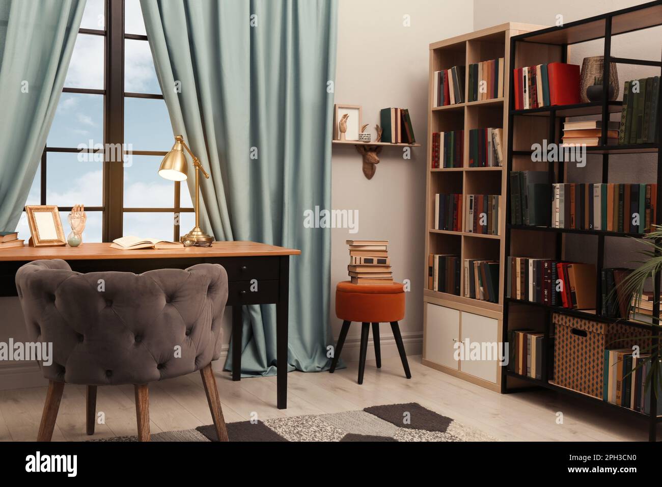 Cozy home library interior with collection of different books on ...