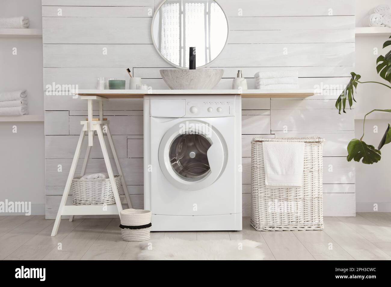 Stylish bathroom interior with modern washing machine Stock Photo - Alamy