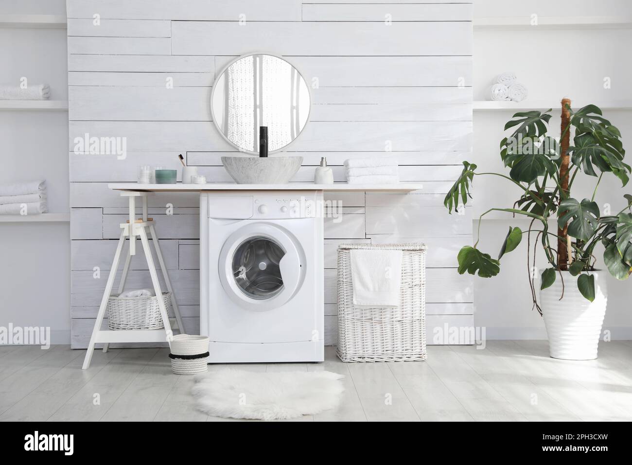 Stylish bathroom interior with modern washing machine Stock Photo - Alamy