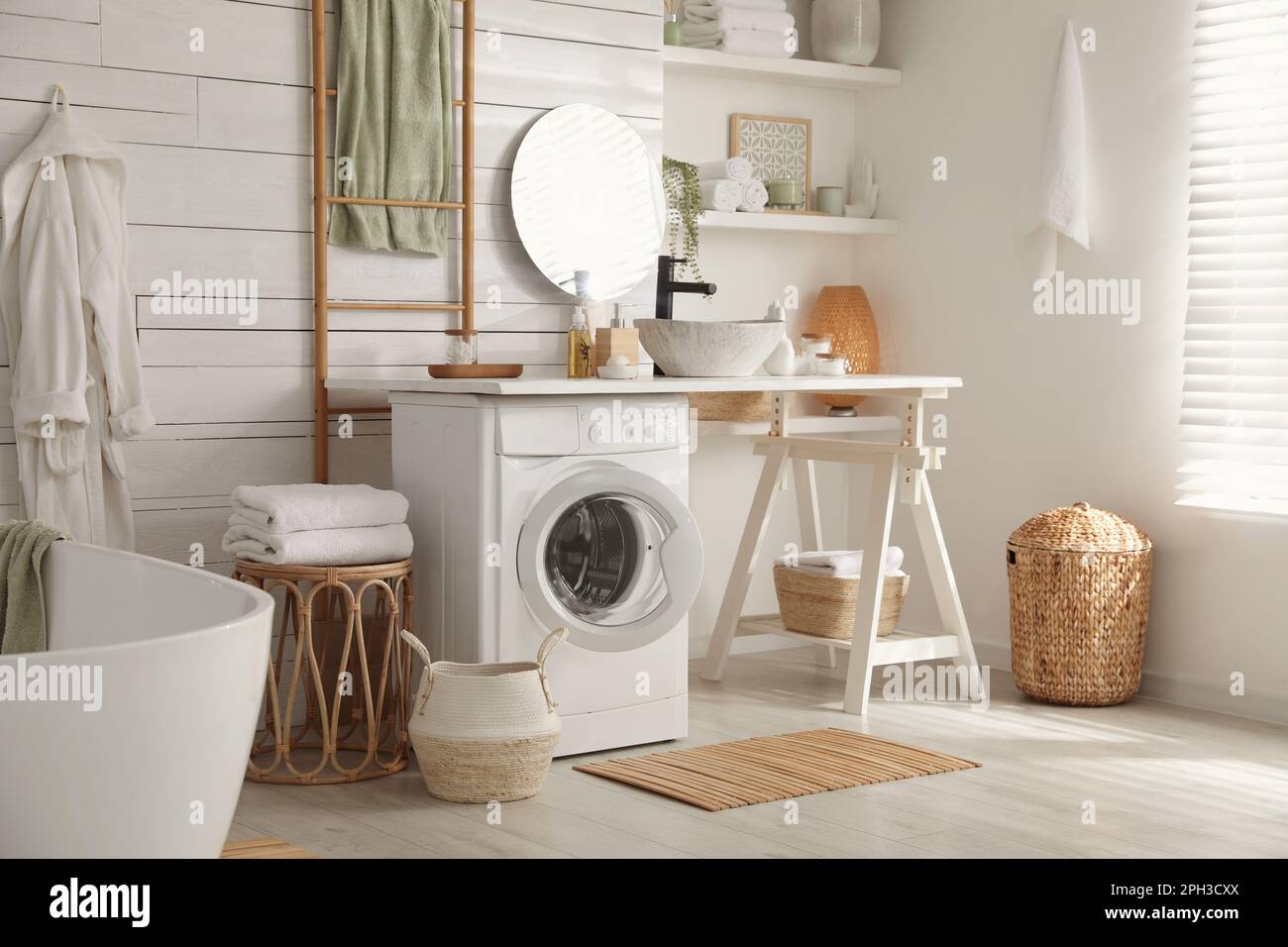 Stylish bathroom interior with modern washing machine Stock Photo - Alamy
