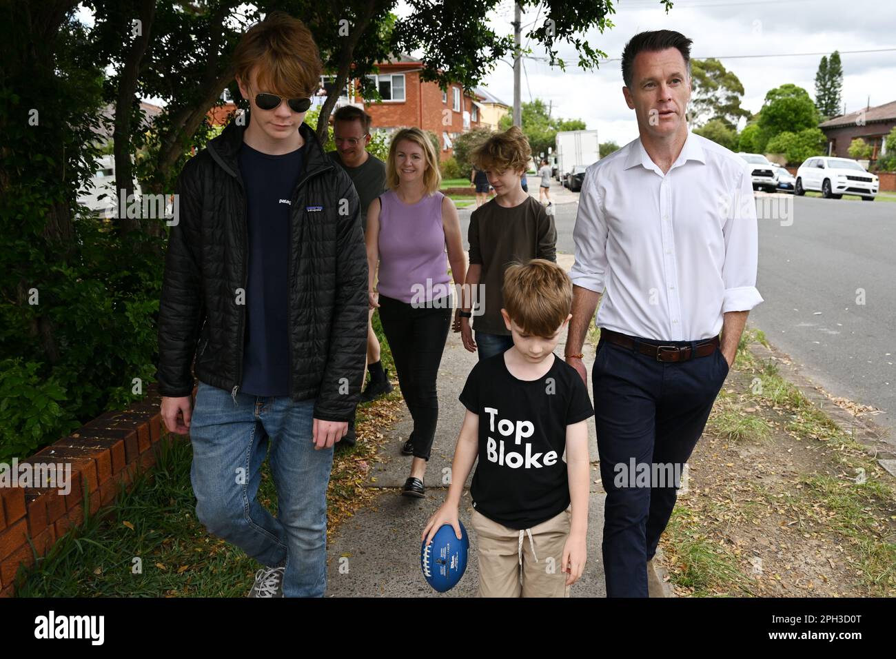 Incoming NSW Premier Chris Minns walks with his wife Anna and sons Joe ...