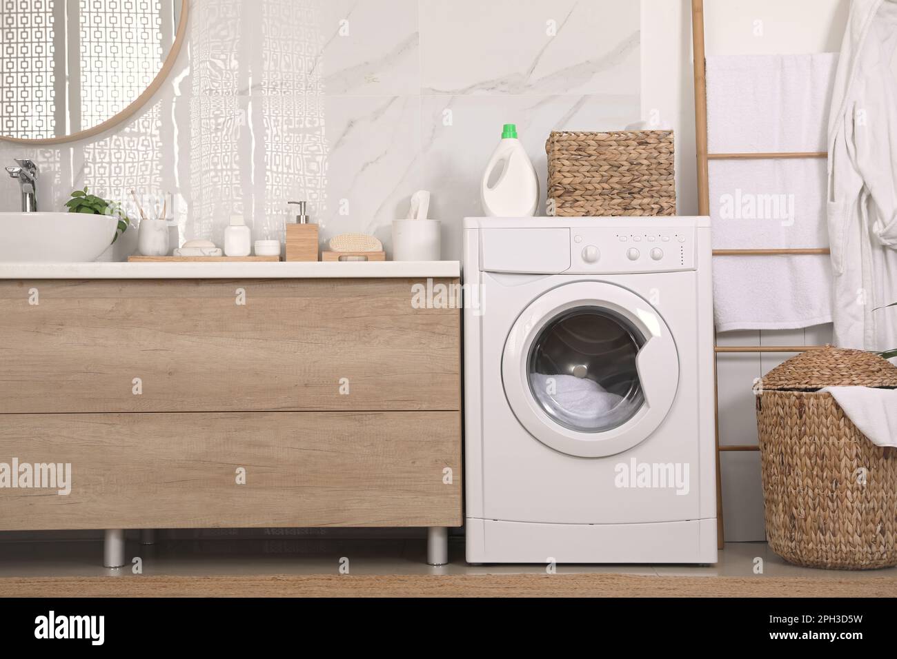 Stylish bathroom interior with modern washing machine Stock Photo - Alamy