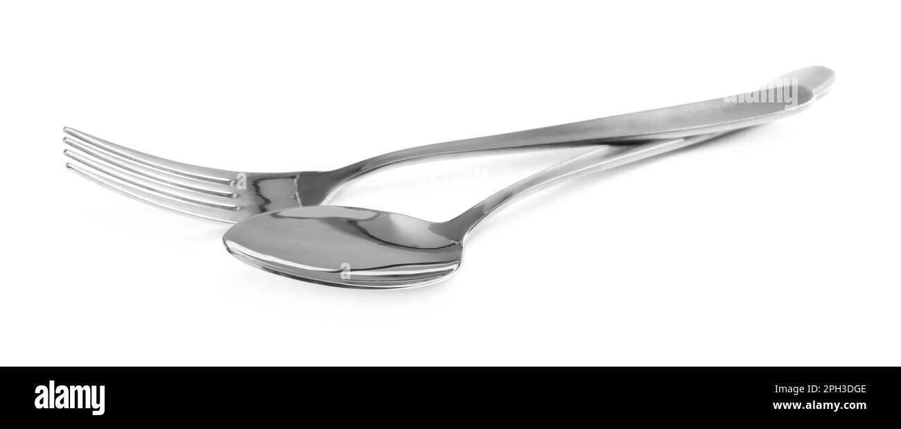 Shiny fork and spoon on white background Stock Photo - Alamy