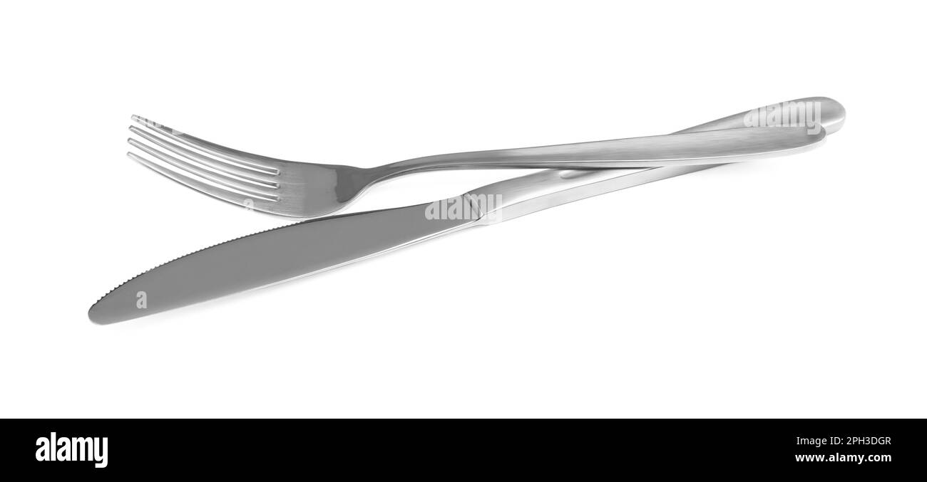 Shiny fork and knife on white background Stock Photo - Alamy