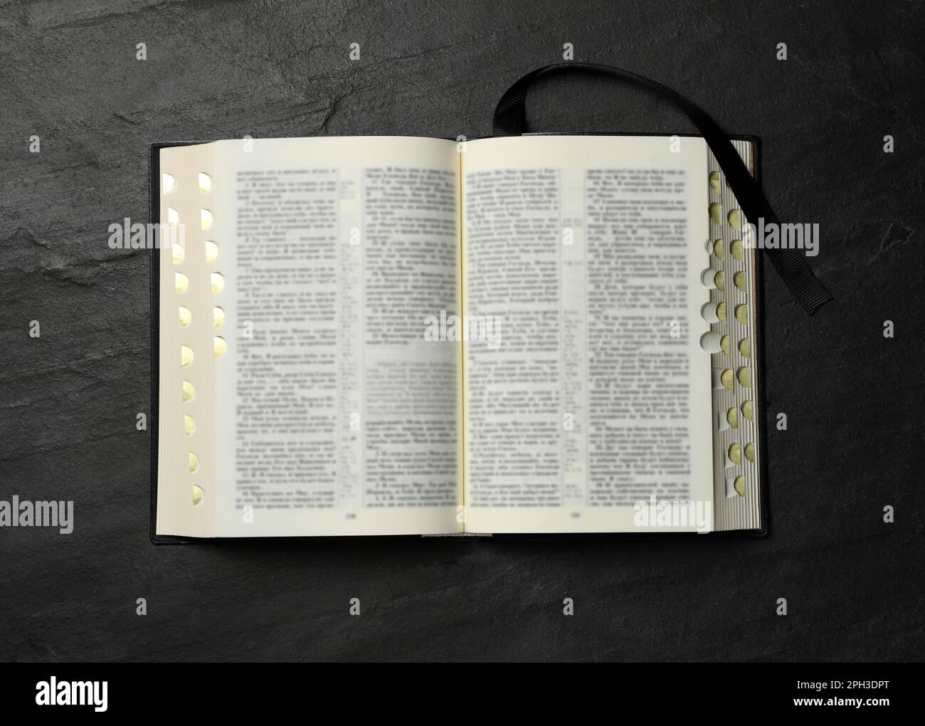 Open Bible on black table, top view. Christian religious book Stock ...