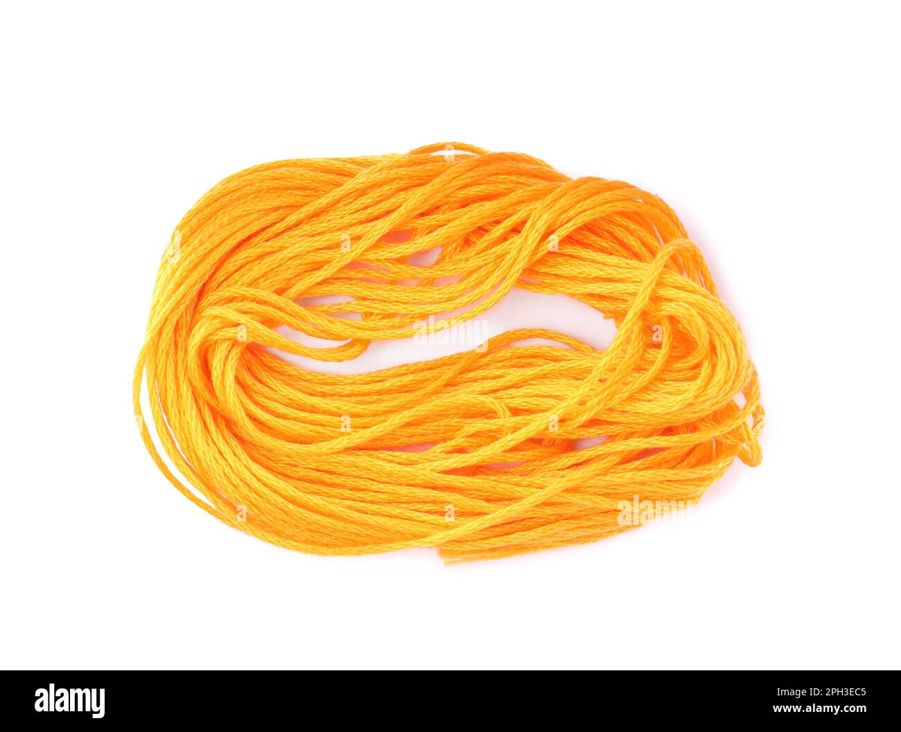 Light orange embroidery thread on white background, top view Stock ...
