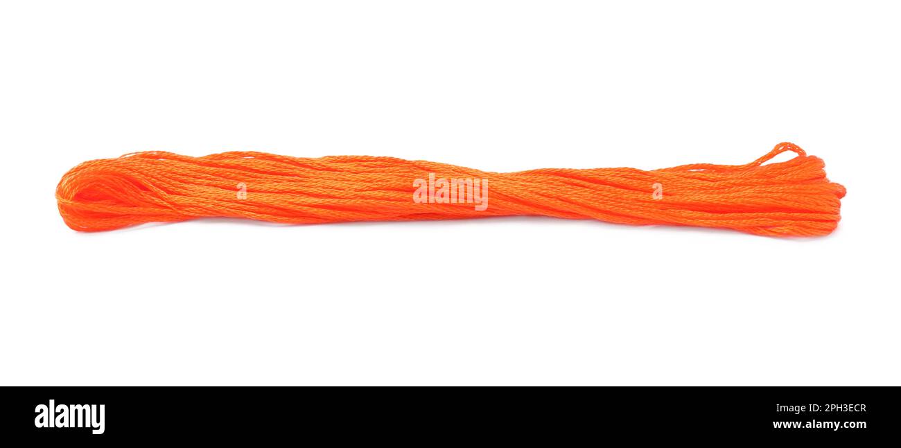Bright orange embroidery thread on white background Stock Photo - Alamy