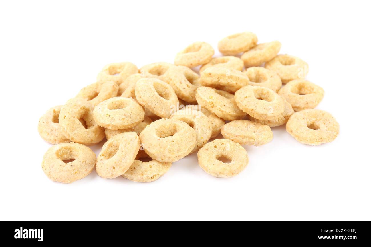 Pile of tasty corn rings on white background. Healthy breakfast cereal ...
