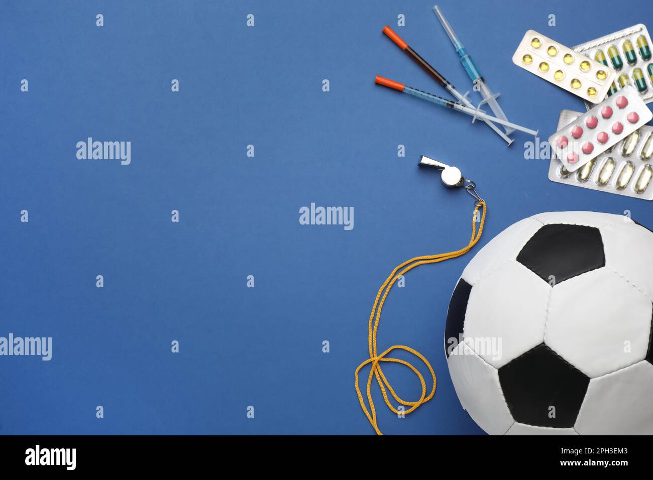 Flat lay composition with soccer ball, whistle and drugs on blue ...