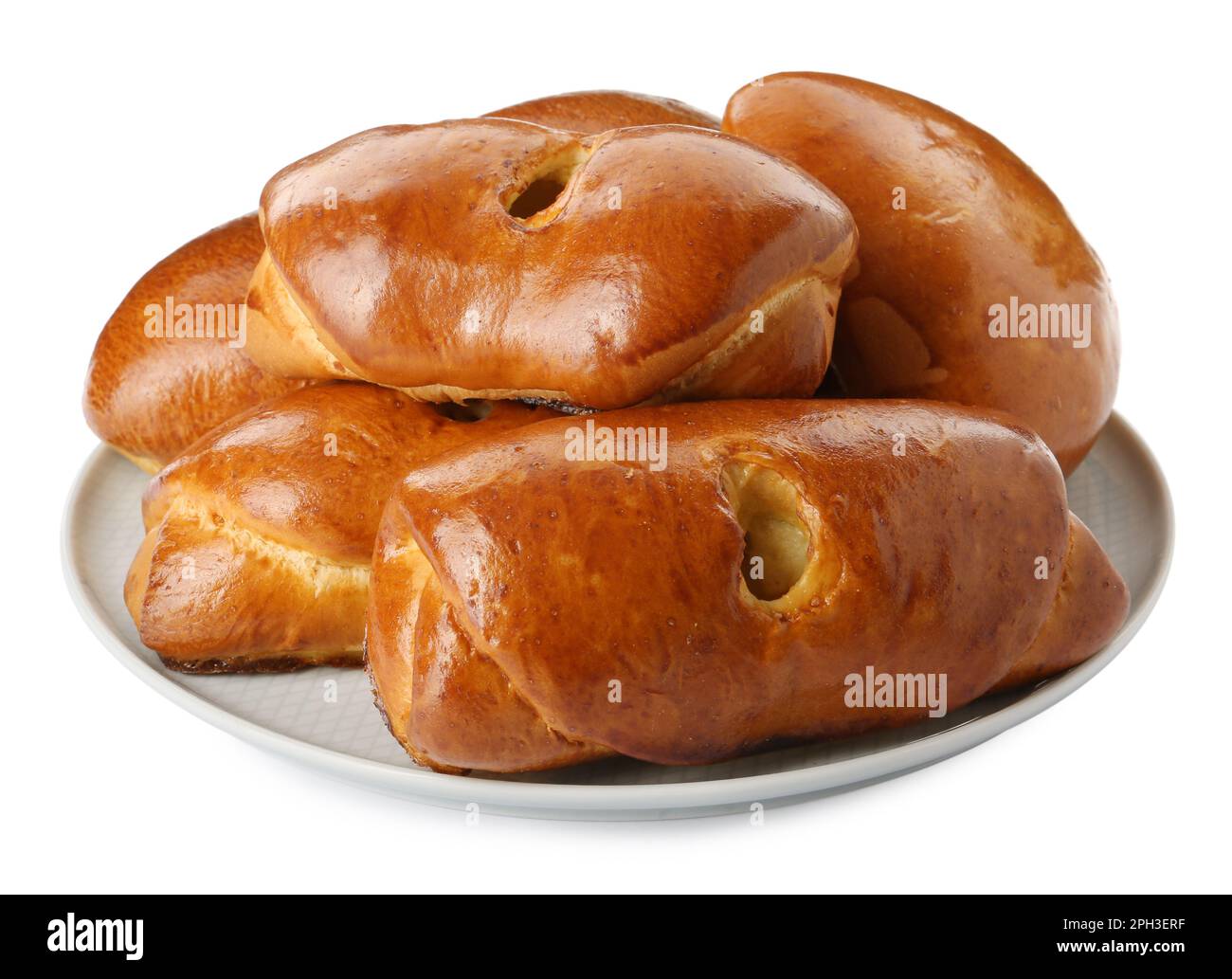 Plate with delicious baked patties on white background Stock Photo - Alamy