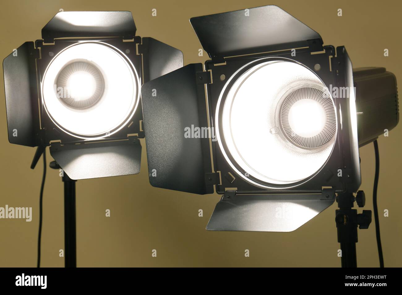 Two modern spotlights against beige background, closeup Stock Photo - Alamy