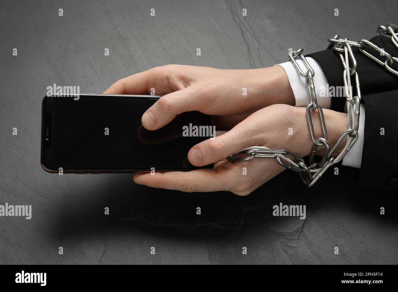 Chained to phone hi-res stock photography and images - Alamy
