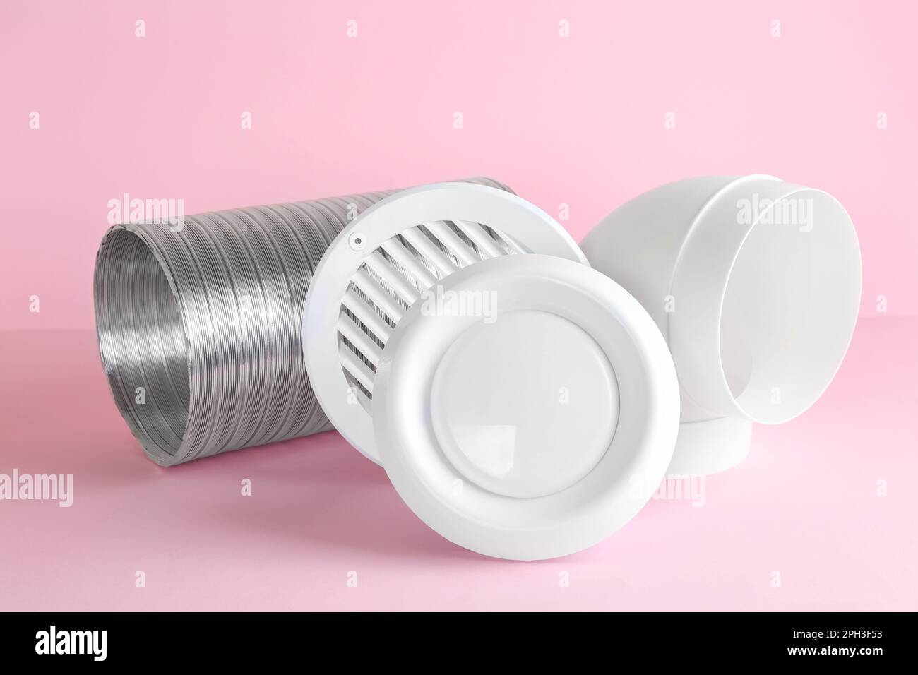 Parts of home ventilation system on pink background Stock Photo - Alamy