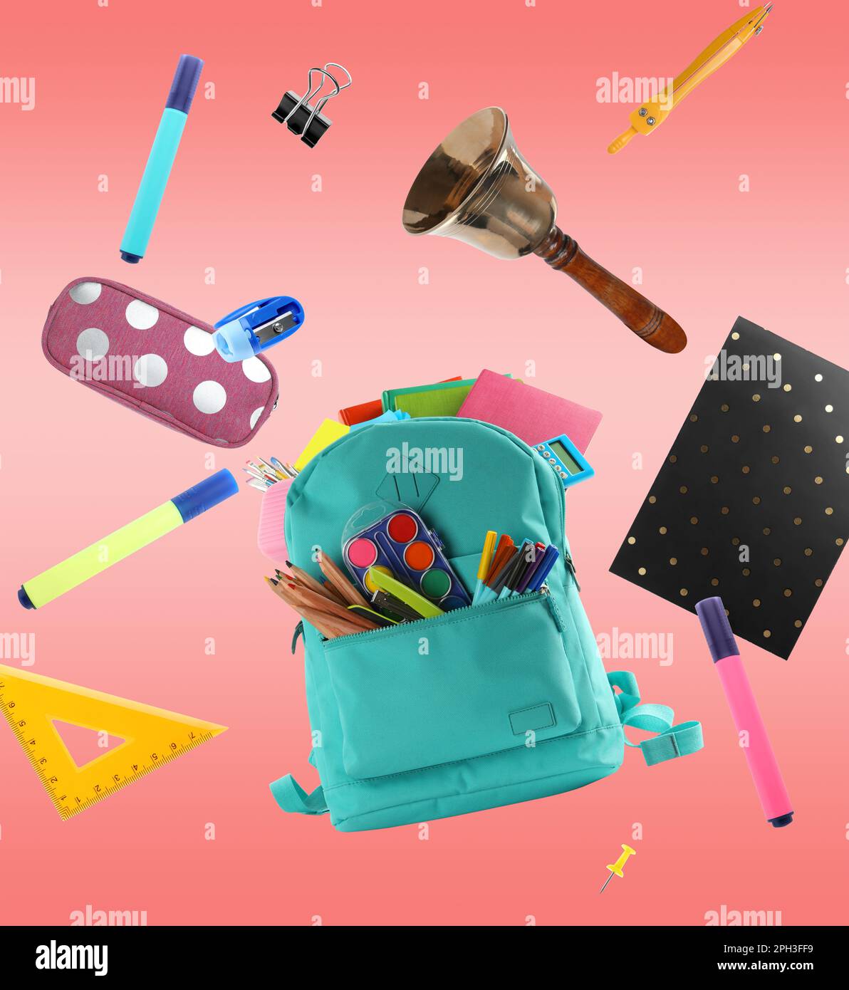 Turquoise backpack, school bell and different stationery flying on ...