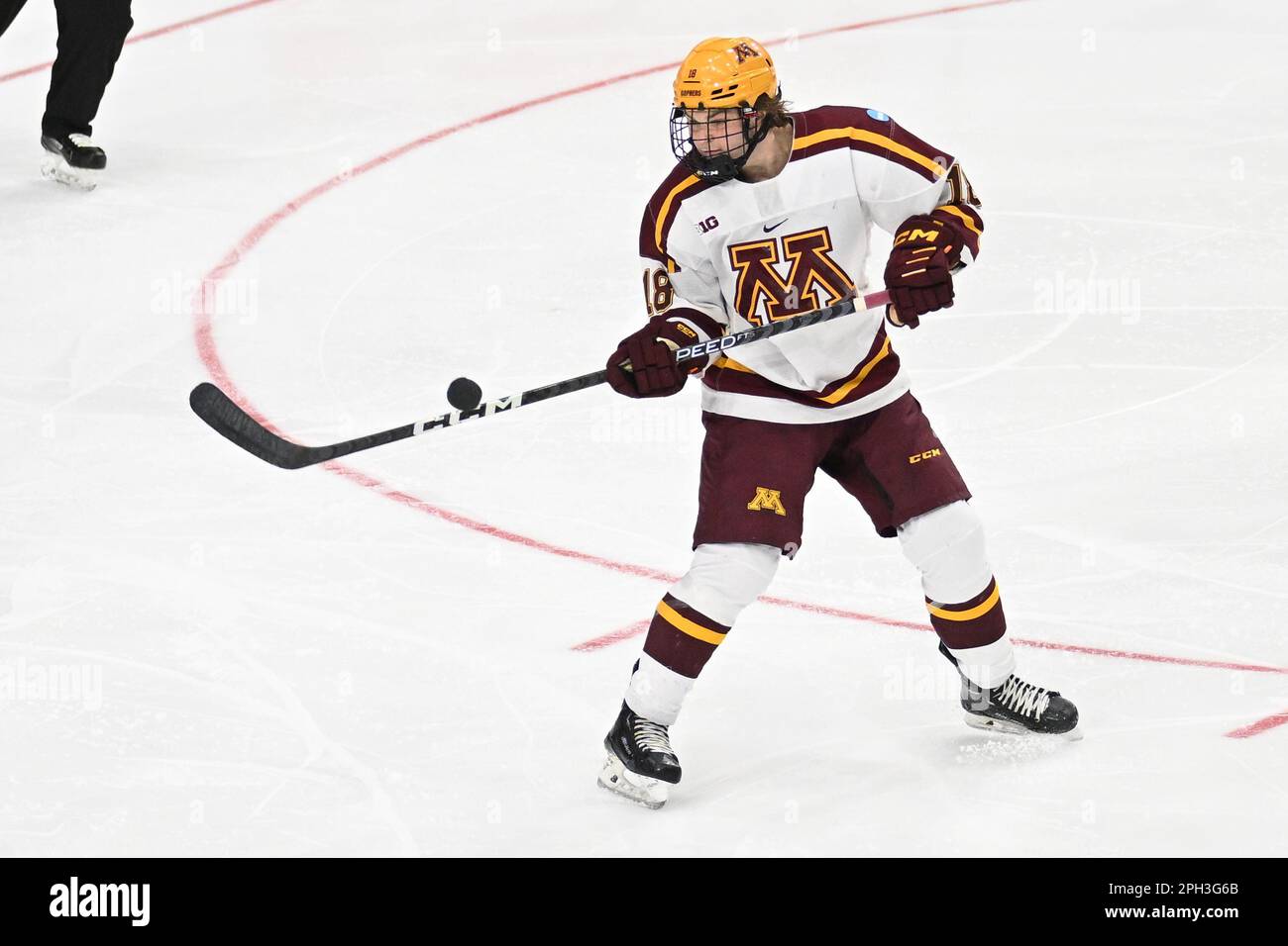 Minnesota Gophers forward Mason Nevers (18) stops a flying puck with ...