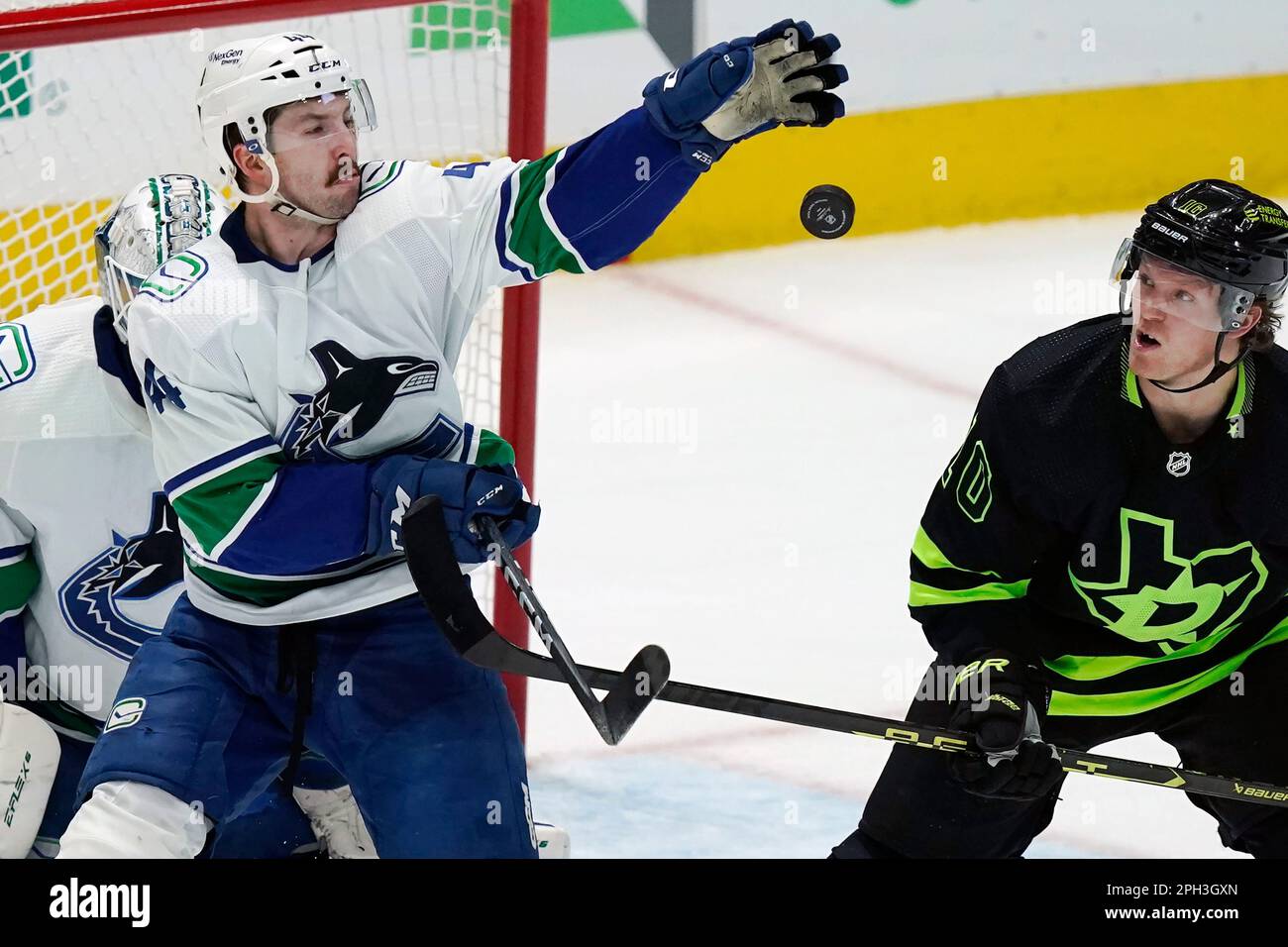 Vancouver Canucks defenseman Kyle Burroughs (44) knocks down the puck ...