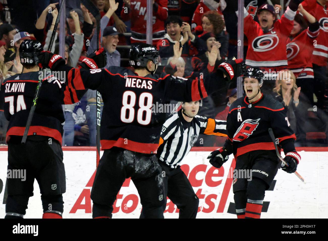 Carolina Hurricanes center Sebastian Aho, right, celebrates his go ...