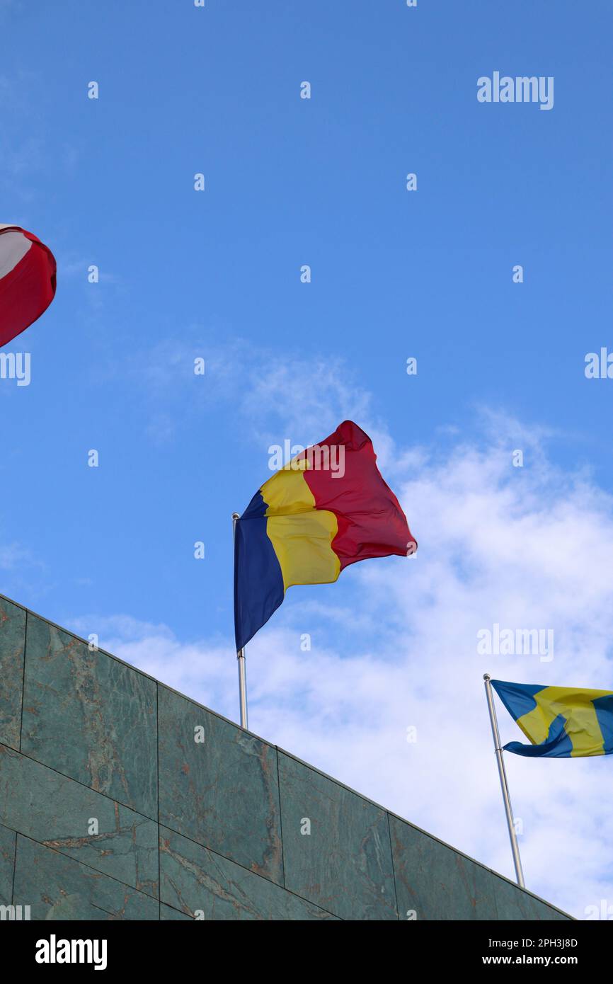 The Romanian Flag Waving on Top of the Building with Other Nations ...