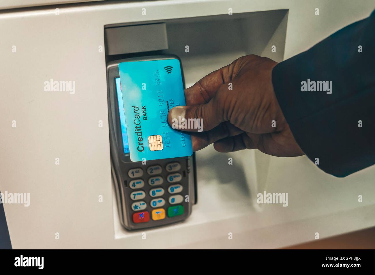 Contactless Payment System. Afro guy in suit holding credit card close ...
