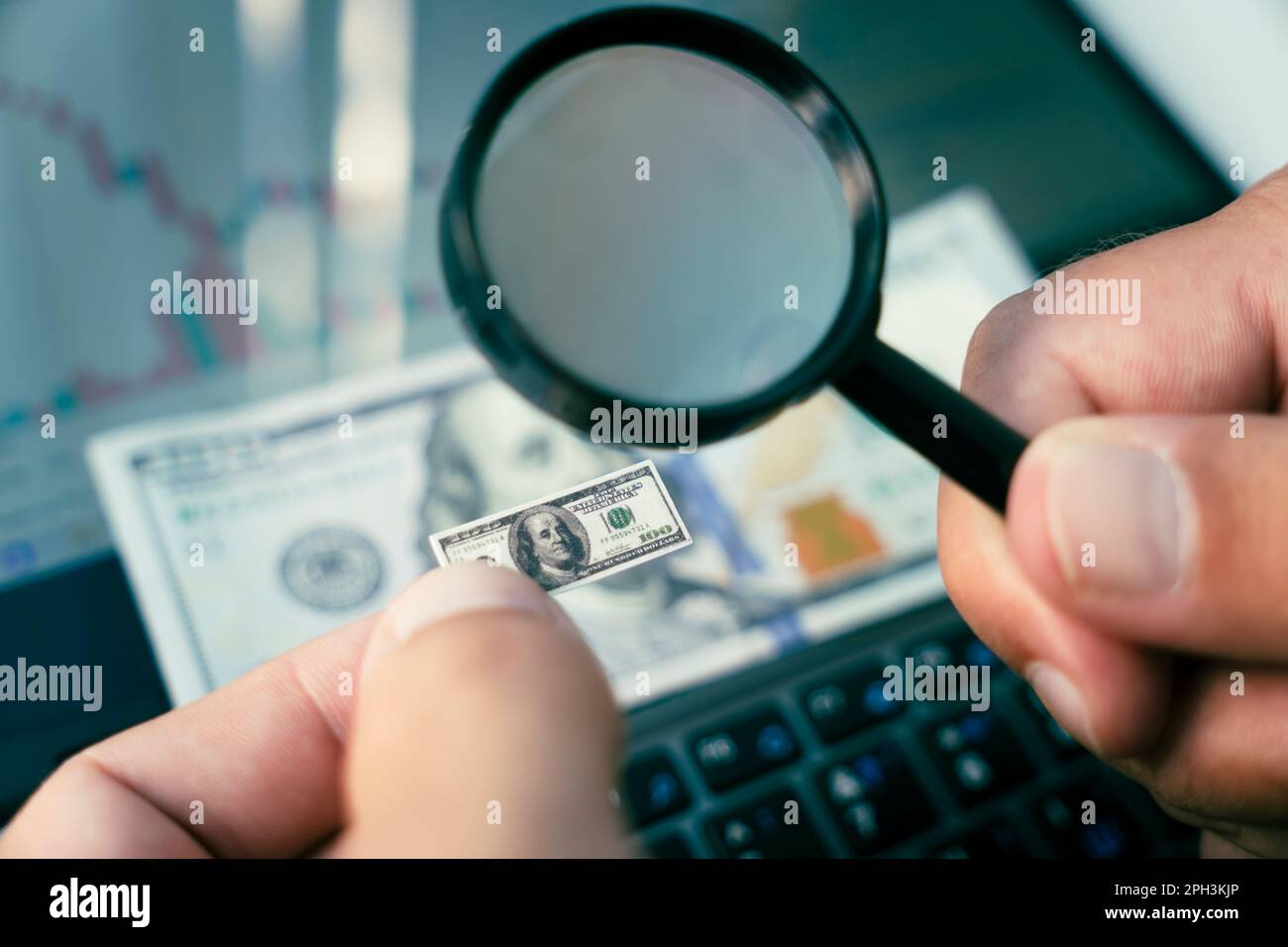 Inflation shrinking value of US dollar. a trader looks at a small ...