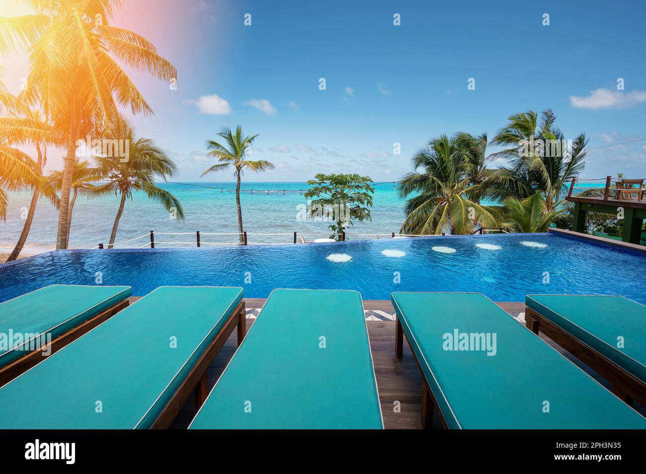 Blue modern pool in Caribbean beach background in sunny light Stock ...