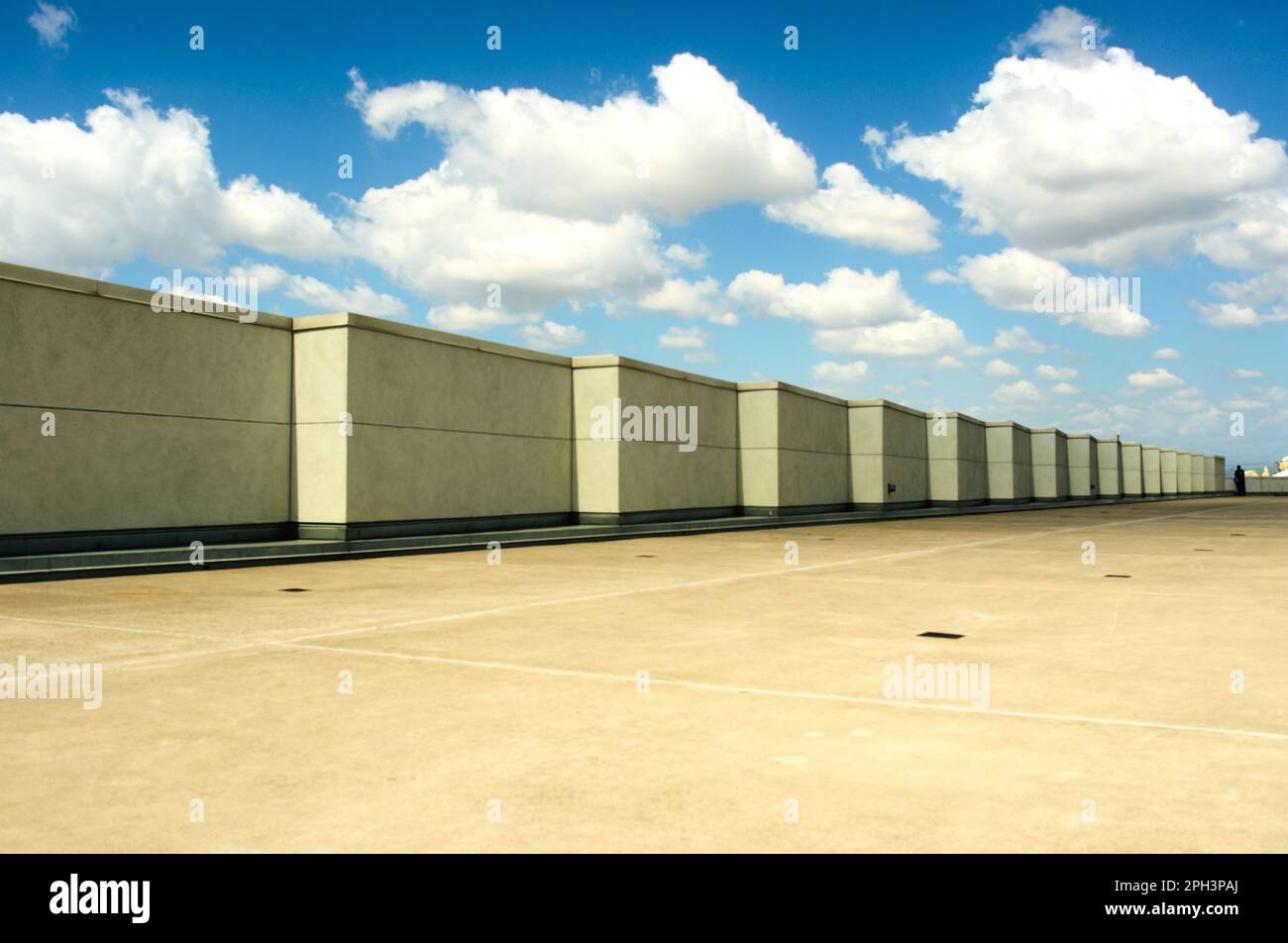 A Stepped Wall on Smooth Concrete under a Cloud Filled Sky. A dramatic ...