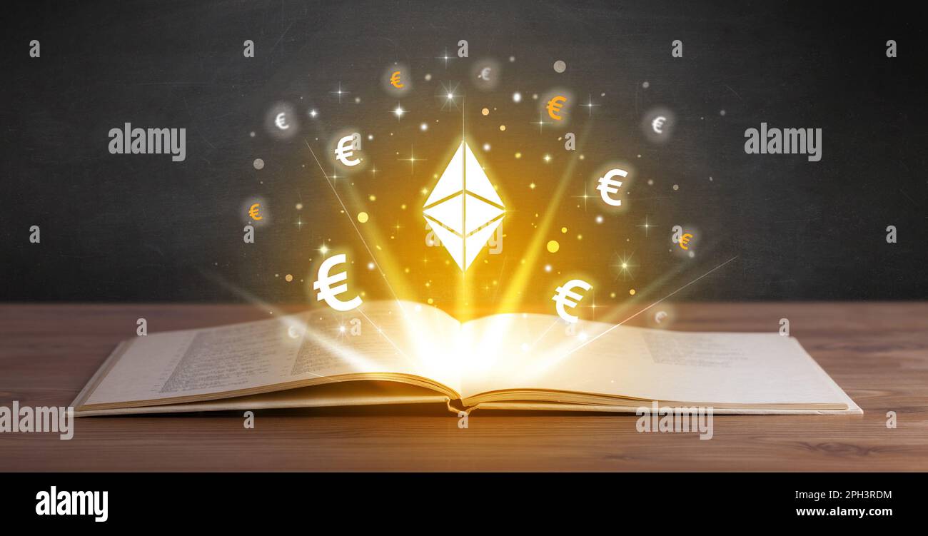 Open book with currency icons above Stock Photo - Alamy