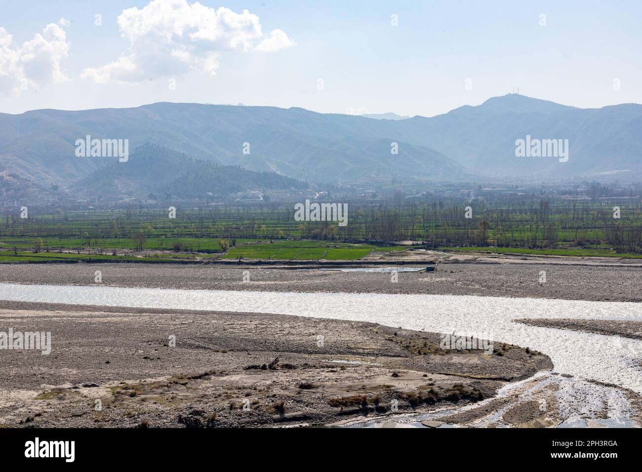 Beautiful scenery of fields along riverbank Stock Photo - Alamy