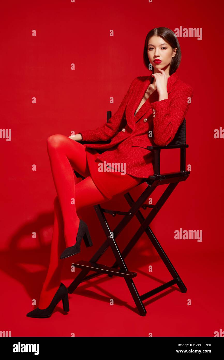Fashion asian female model in red jacket and skirt. High fashion Stock ...