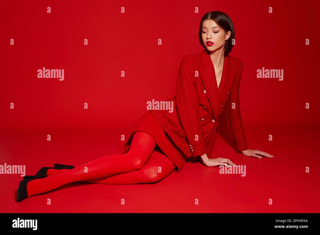 Fashion asian female model in red jacket and skirt. High fashion Stock ...