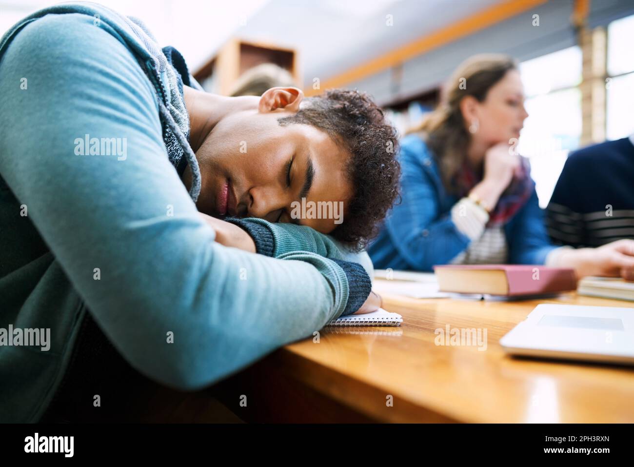 I just need a power nap. a university student falling asleep in the ...