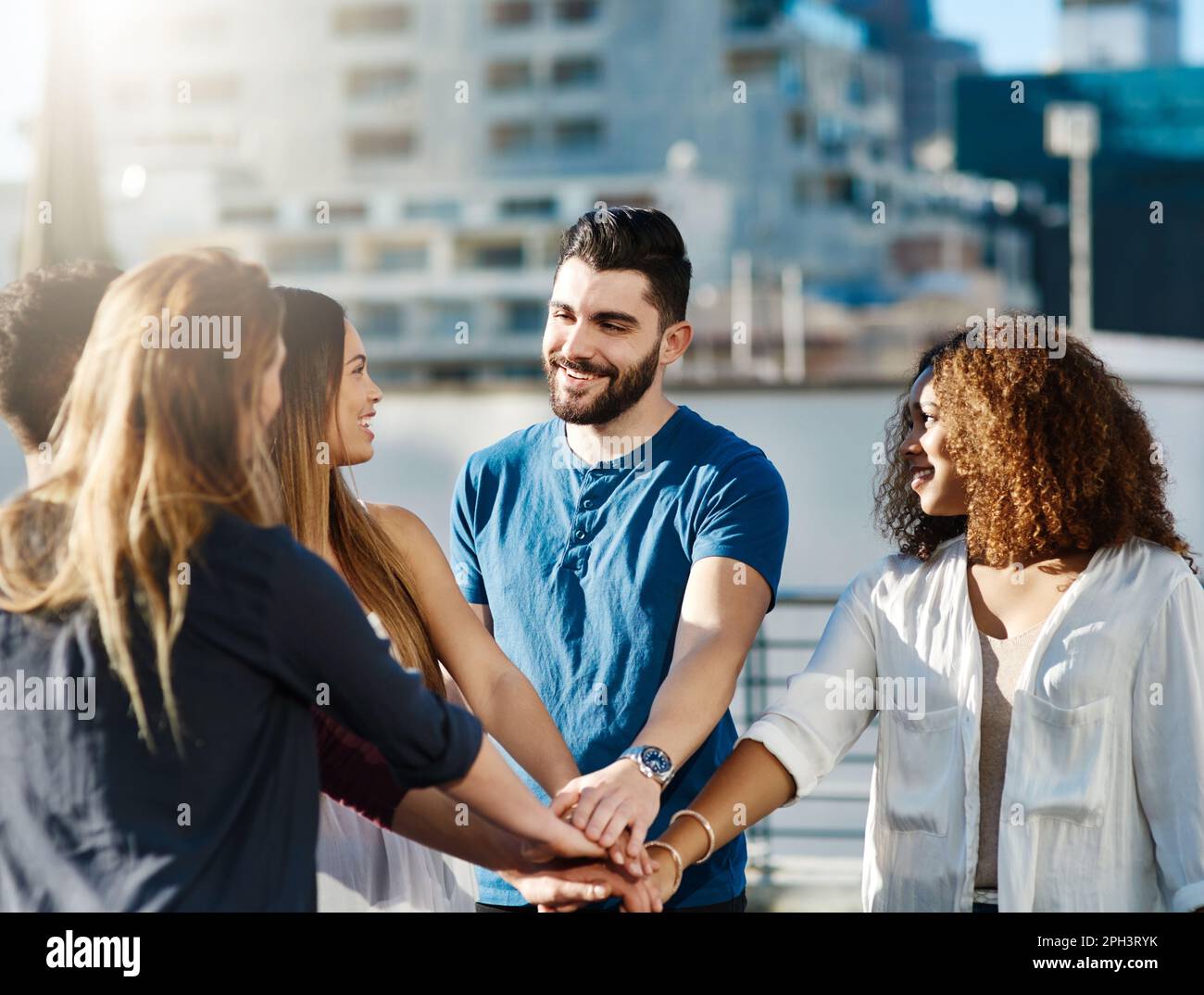 We got the best team. a group of people putting their hands together in ...