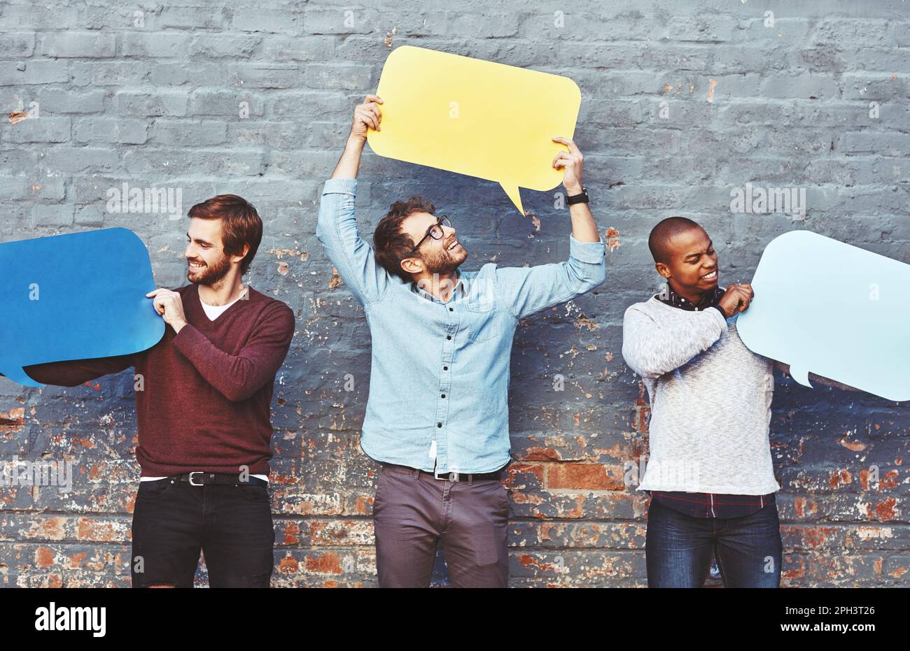 We needed to say something. a group of young men holding speech bubbles ...