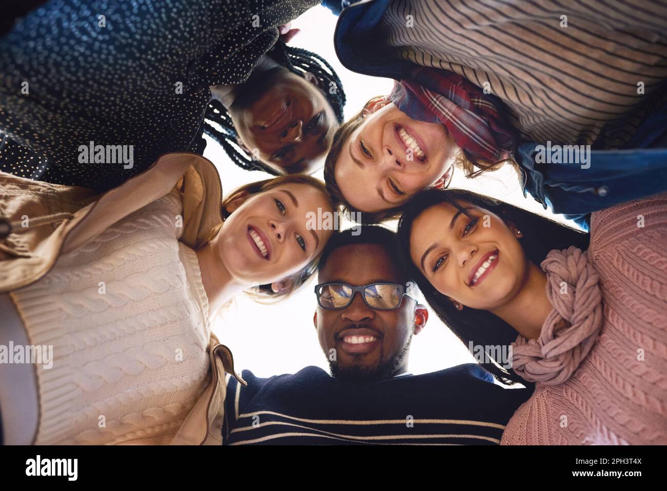 We bump heads but thats what friends do. Low angle portrait of a group ...
