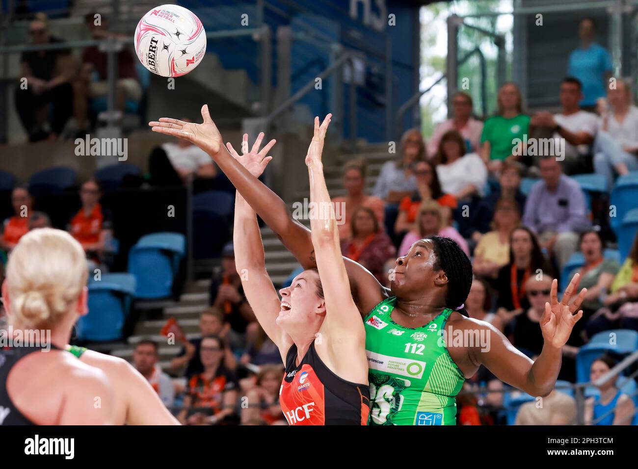 Lauren Moore of the Giants beats Jhaniele Fowler of the Fever to the ...