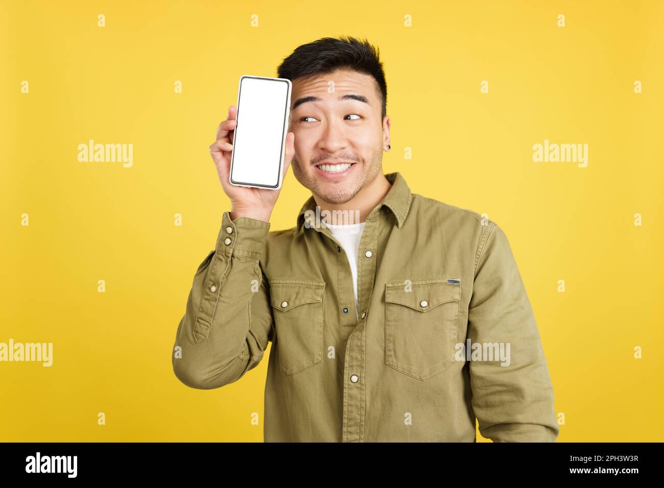 Cool chinese man holding a mobile with a blank screen Stock Photo - Alamy
