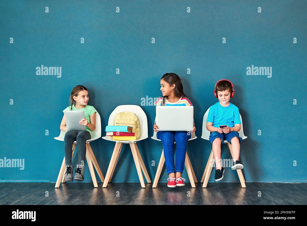 Enhancing the learning process with modern tech. Studio shot of kids ...