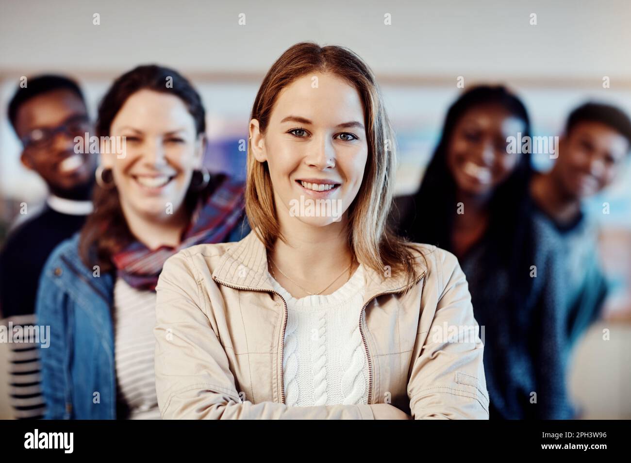 Our knowledge equals success. Portrait of a group of confident young ...